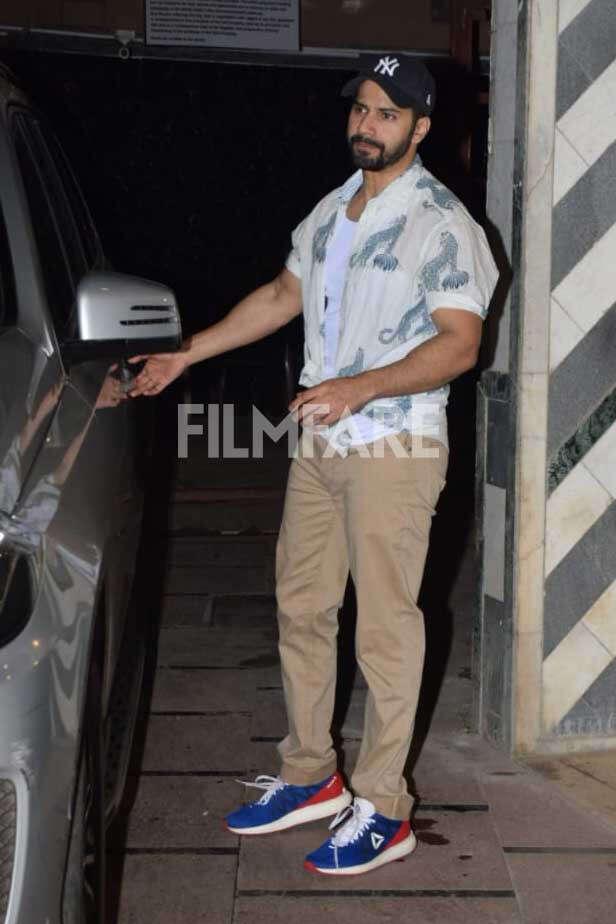 Varun Dhawan clicked in a tropical shirt and brown pants at gym ...