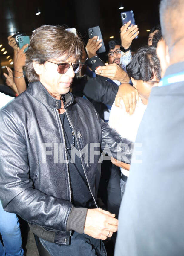 Shah Rukh Khan looks dapper as he arrives at the airport. See pics ...