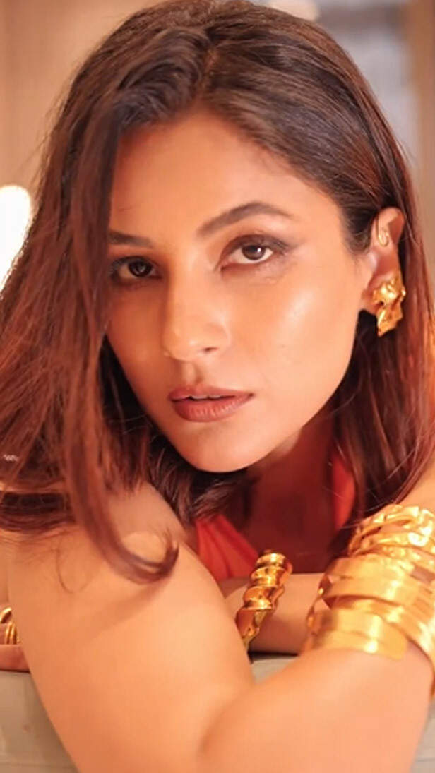 Shehnaaz Gill raises the temperature with a stunning orange gown. See ...